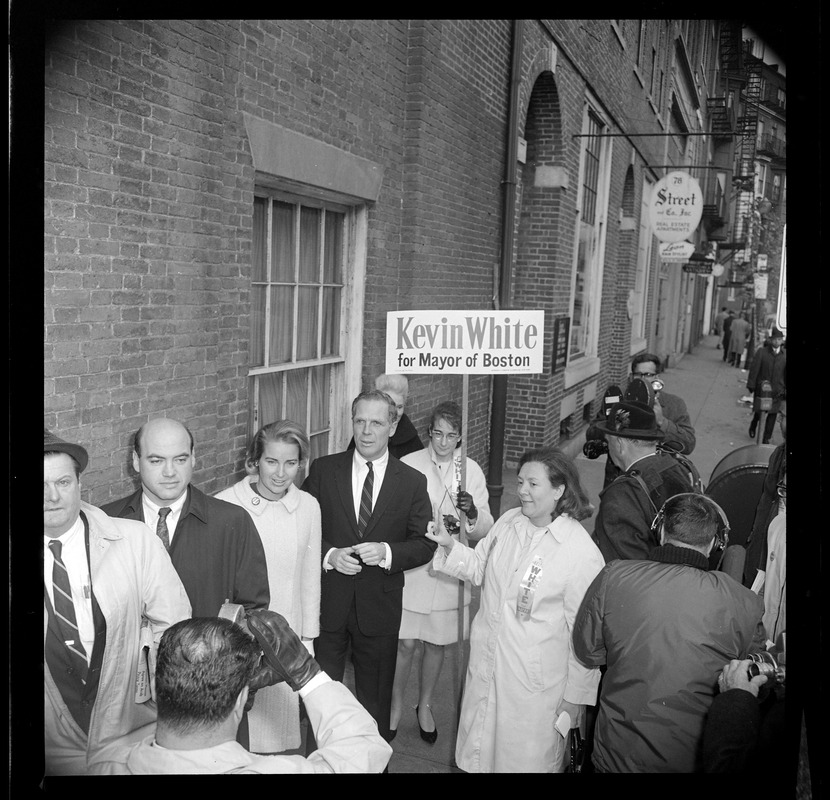 Mayor-Elect Kevin White on the sidewalk, surrounded by supporters ...