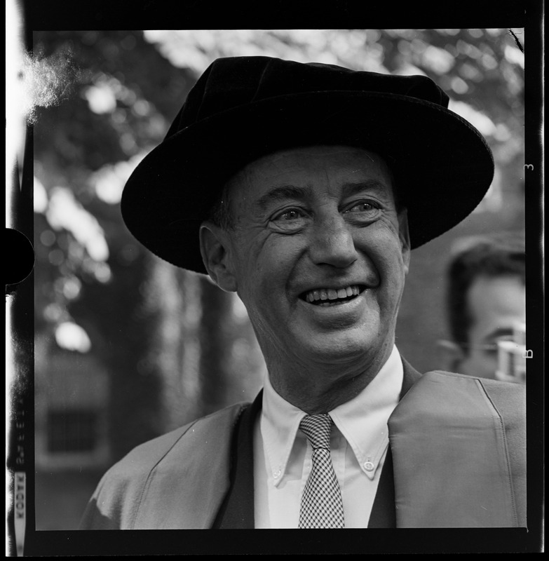 Adlai Stevenson wearing a academic hat and smiling - Digital Commonwealth