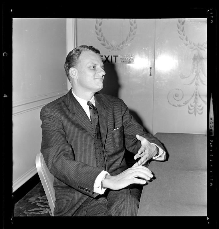 Evangelist Billy Graham during news conference at the Statler Hotel ...