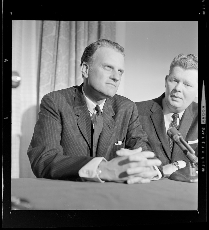 Evangelist Billy Graham and another man during a news conference ...
