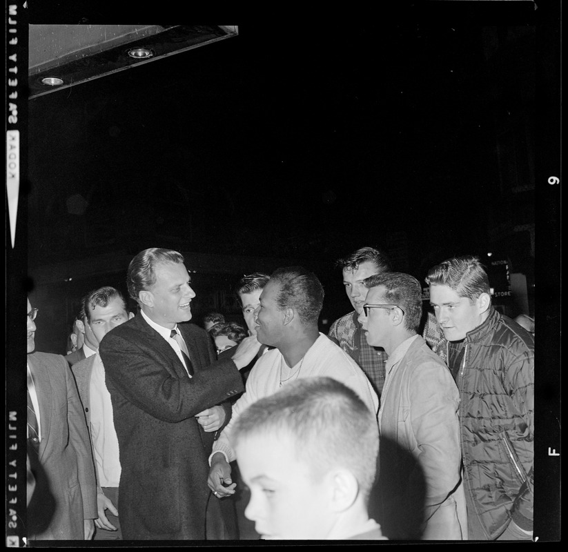 Evangelist Dr. Billy Graham meeting with fans on the streets of Boston ...