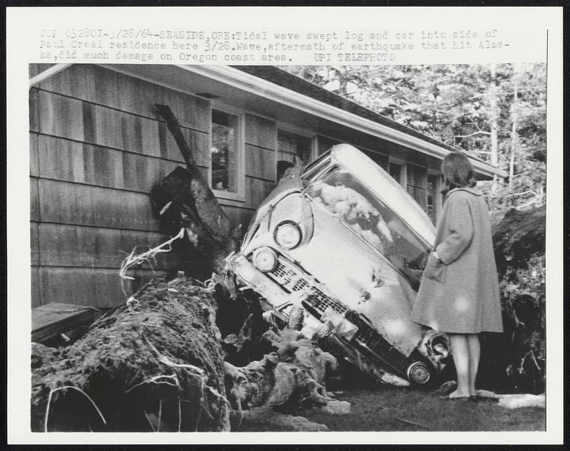 Tidal wave swept log and car into side of Paul Creal residence here 3/ ...