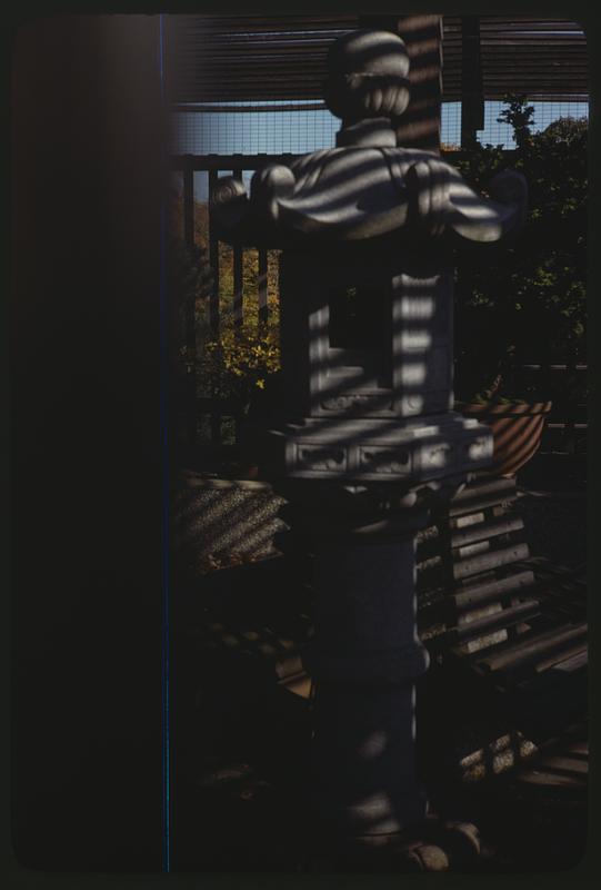 Stone lantern in shadow - Digital Commonwealth