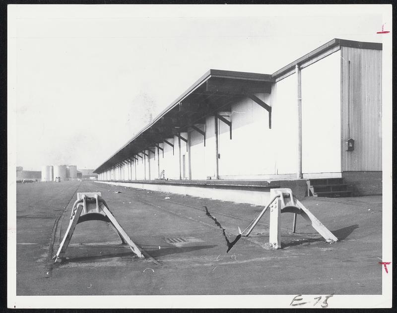 Desolate + deserted leading platforms at waterfront warehouse - Digital ...