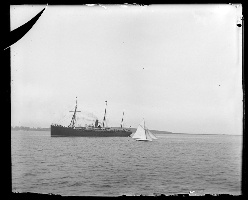 Three-masted schooner and sailboat in harbor - Digital Commonwealth