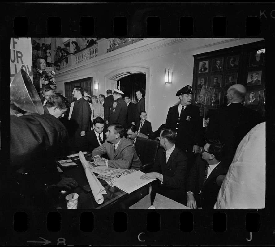 Police officer standing behind Edward J. Logue of Boston Redevelopment ...
