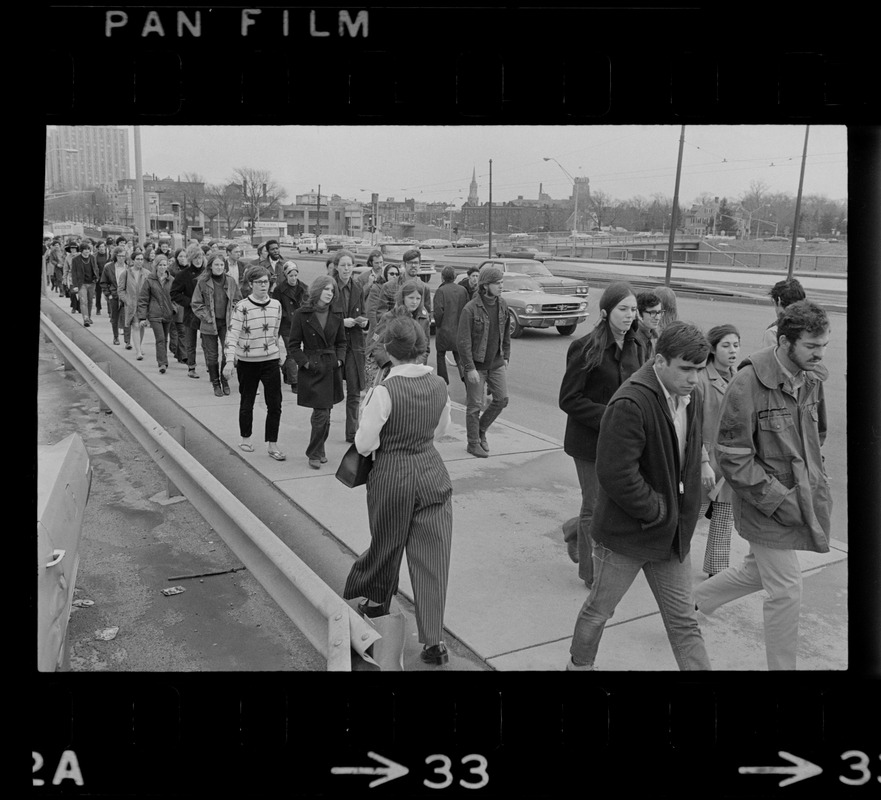 Students walking along street during rally in support of SDS members at ...
