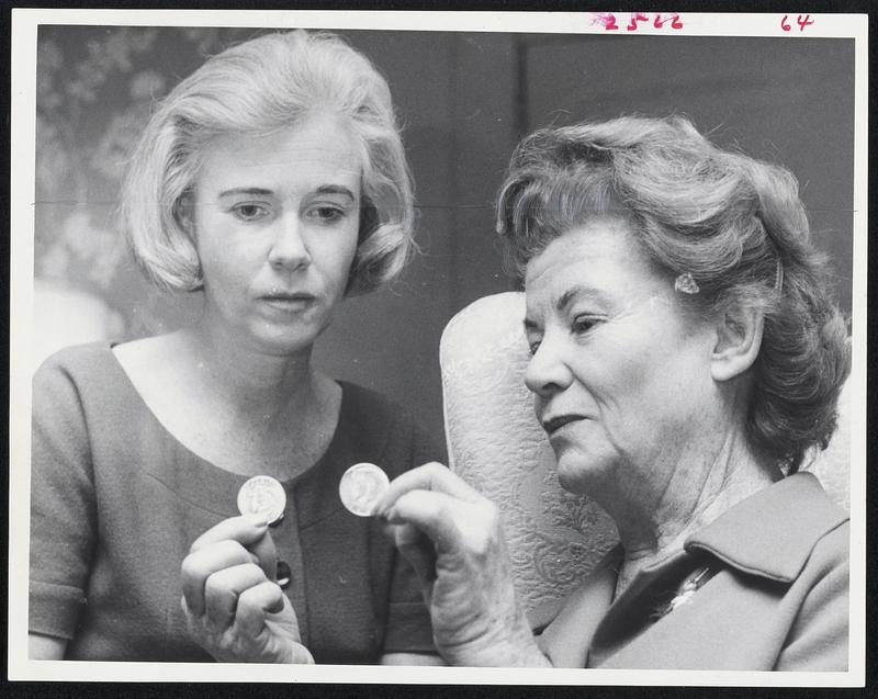 Prestige Coins--Miss Ann Sargent, left, and Miss Eva Adams examine ...