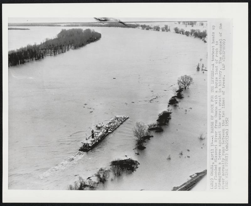 A Barge of Rock for the Levees--A towboat heads up the flooded Missouri ...