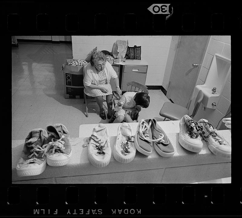 Retired volunteer "foster grandmother" works with retarded child at the ...