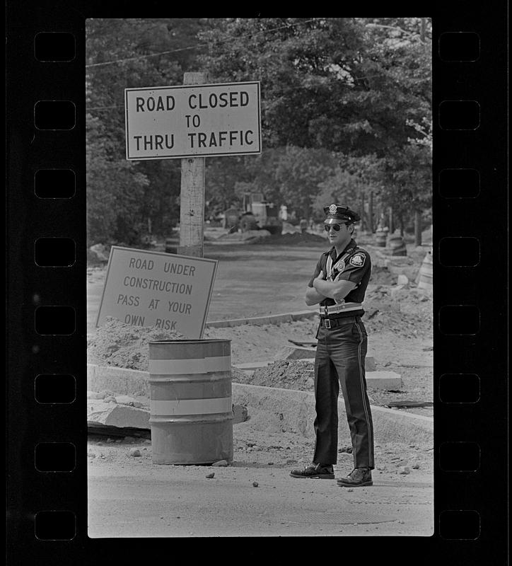 Police officer supervising road work - Digital Commonwealth