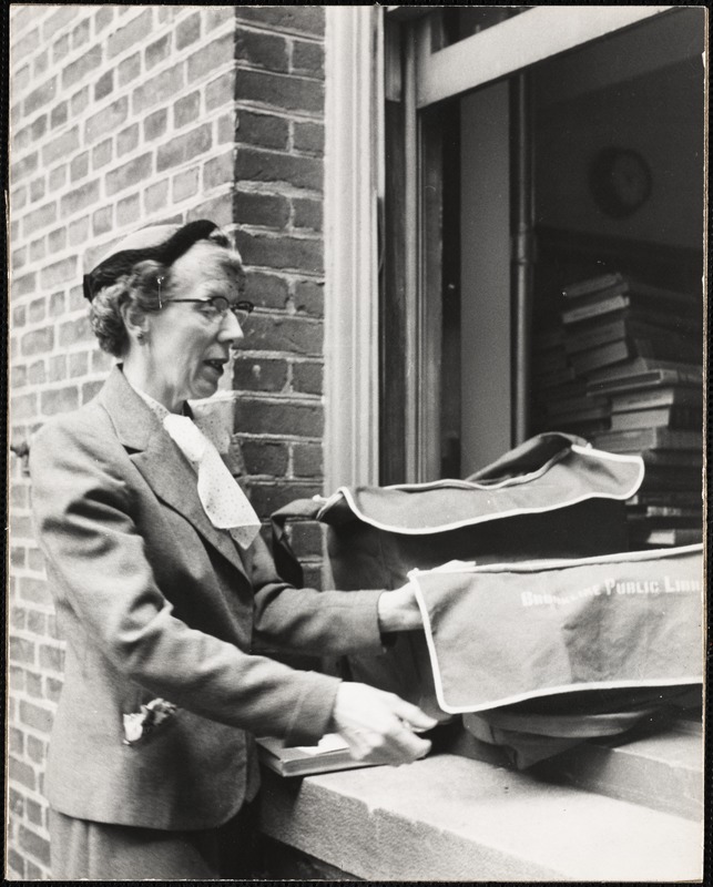 Miss Thompson readies books for delivery to shut-ins - Digital Commonwealth