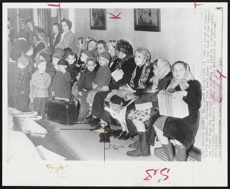 Waiting in Line-- A group of Council Bluffs resident, evacuated from ...