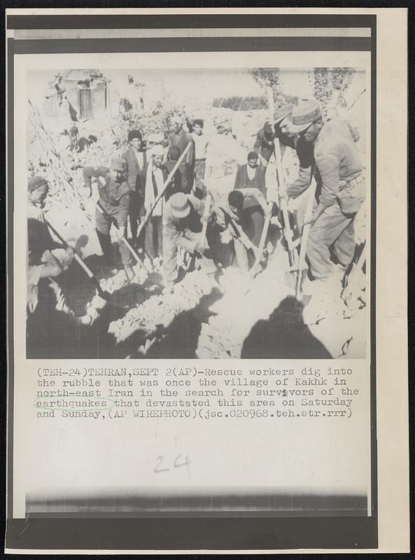 Rescue workers dig into the rubble that was once the village of Kakhk ...