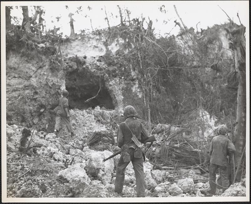 Marine infantrymen warily approach an enemy cave on Guam - Digital ...