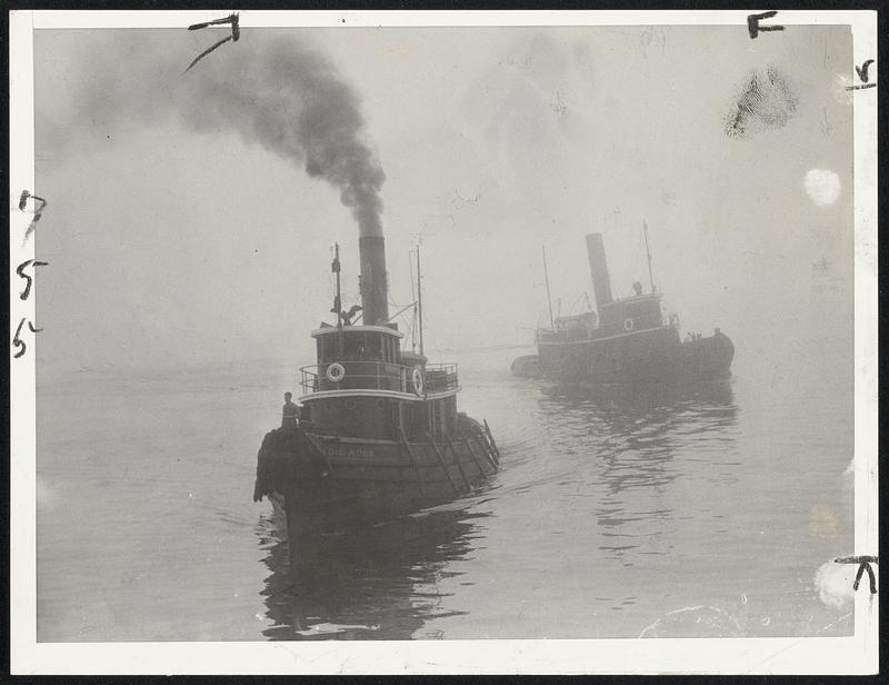 Defying Fog, the tugs Sadie Ross and Irving Ross are shown on their way ...