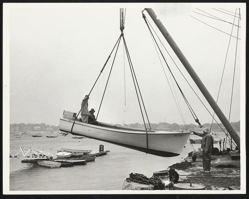 Boat is hauled in out of Marblehead Harbor as precautionary move prior ...