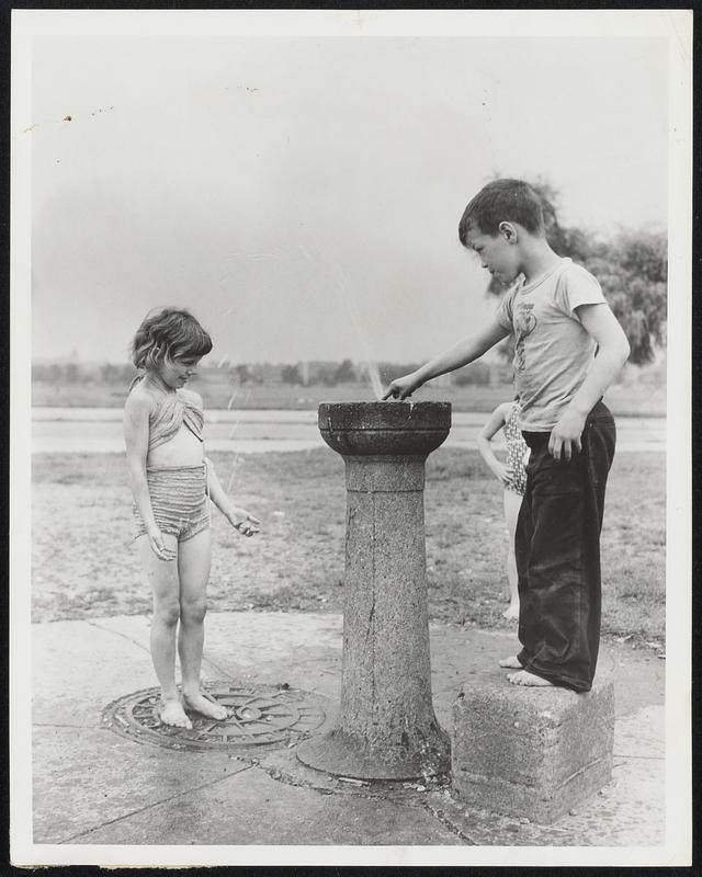 Squirt Squirts Squirt-- A familiar hot weather pastime is indulged in ...