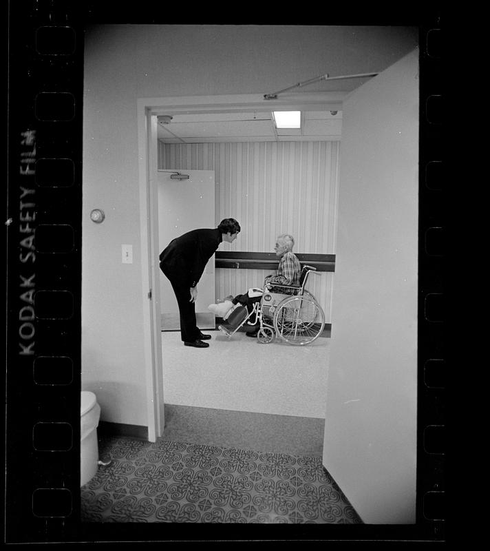 Young priest at home for elderly, Chelsea - Digital Commonwealth