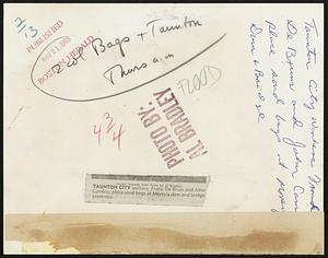 Taunton City workers, Frank De Brum and John Cambra, place sand bags at ...