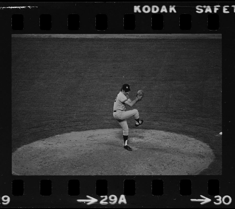 New York Yankees relief pitcher Sparky Lyle (#28) begins his delivery ...