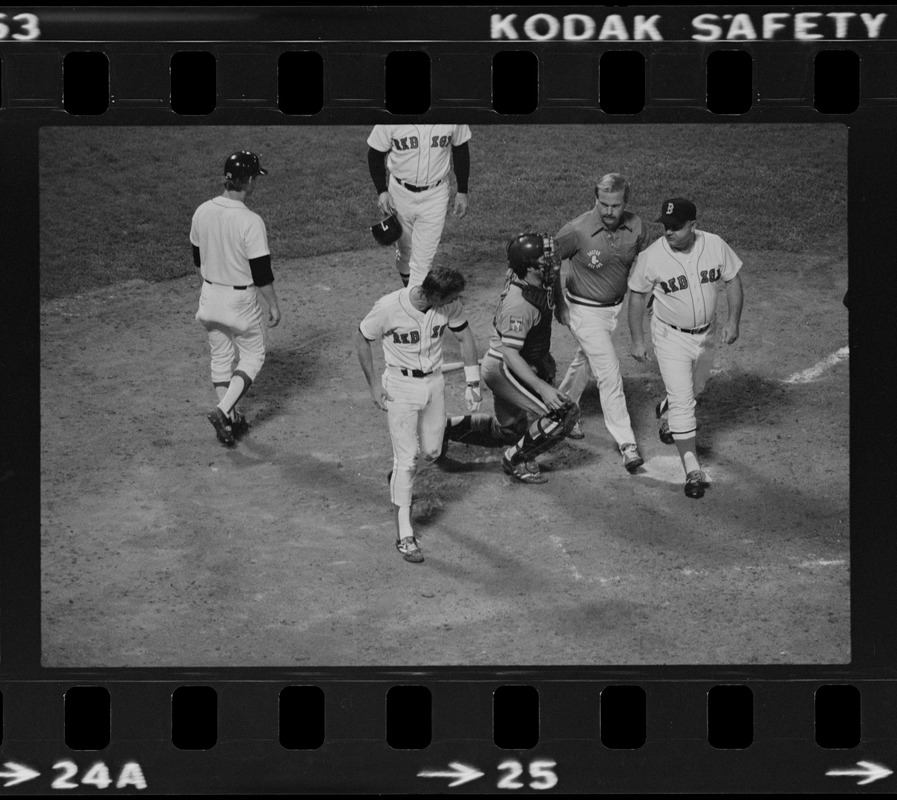 Red Sox batter Rick Burleson (#7) walks away from home plate (after ...