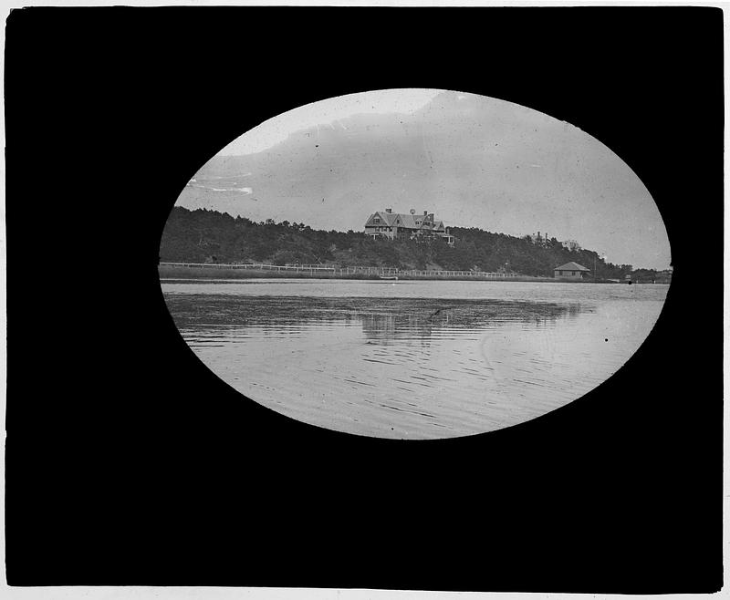 Vignette view of large house on rise above body of water - Digital ...