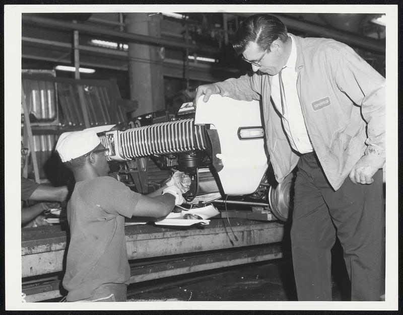 Watching the Worker. At The Dearborn, Mich., assembly line of the Ford ...