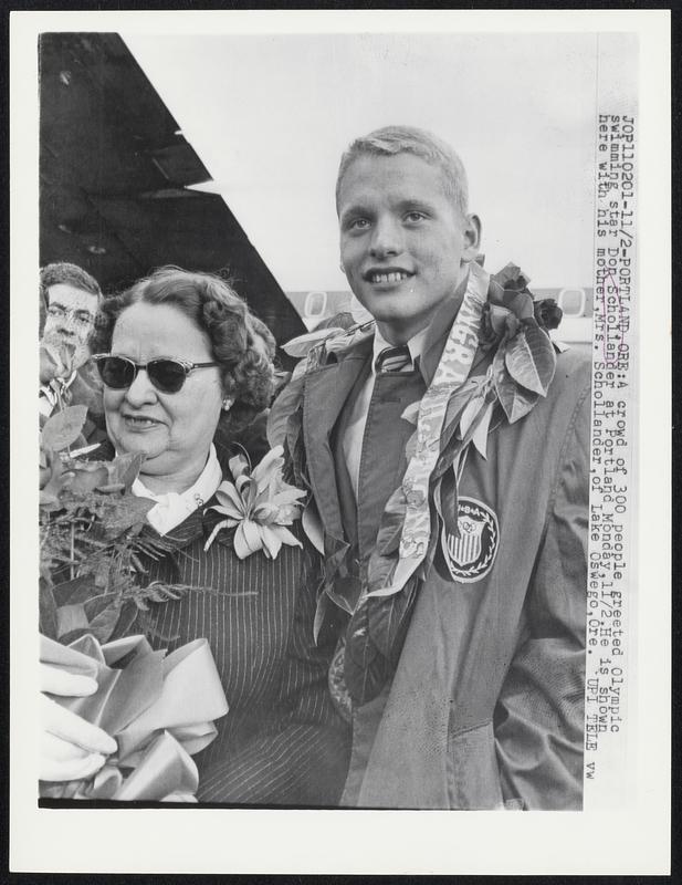 A crowd of 300 people greeted Olympic swimming star Don Schollander at ...