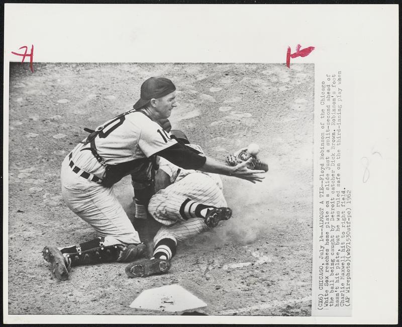 Almost a Tie--Floyd Robinson of the Chicago White Sox reaches home ...
