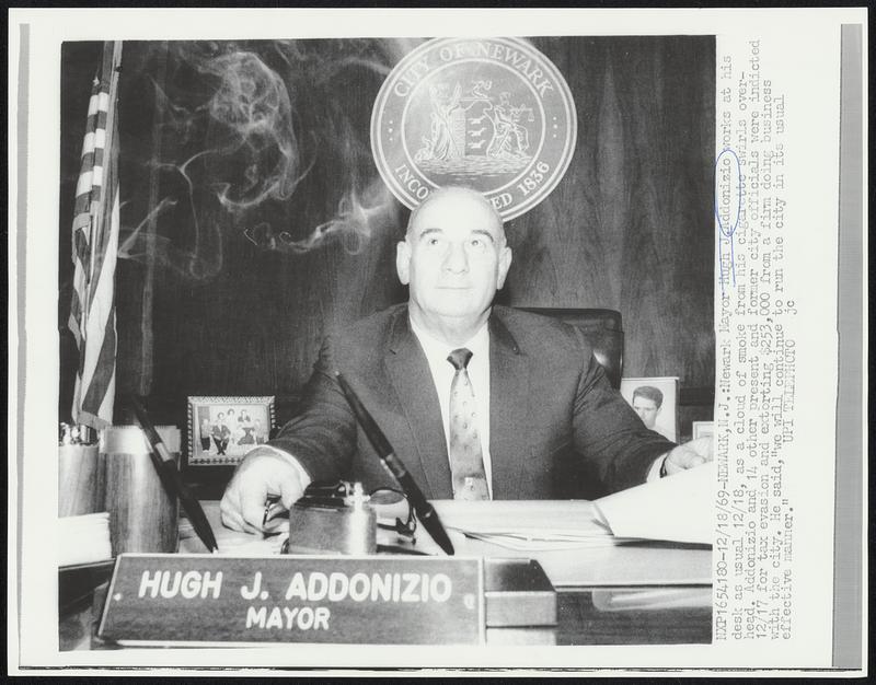 Newark, N. J.: Newark Mayor Hugh J. Addonizio works at his desk as ...