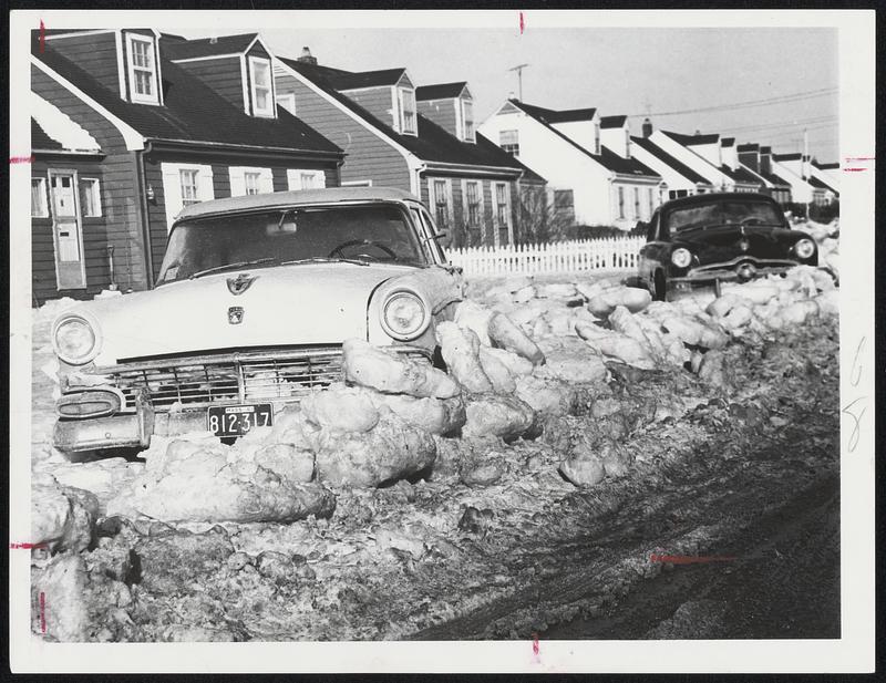 Six Days after the big snow storm and flood this car is blocked by big ...