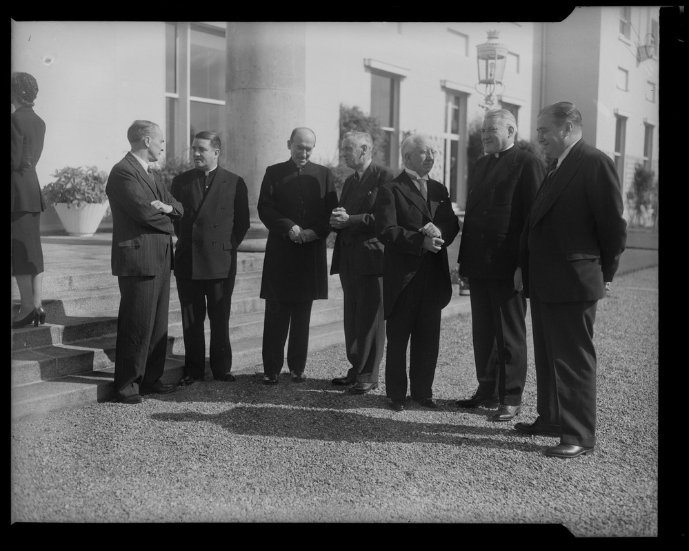 Group of men and clergy, including Rev. Cushing and Gov. Paul Dever ...