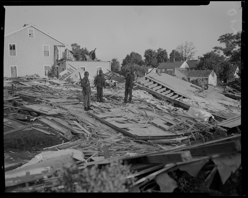 Three military men at site of destroyed homes and buildings - Digital ...