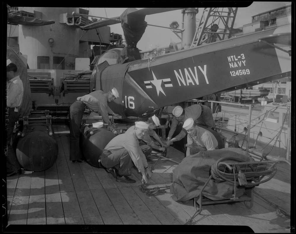 Military men working on Navy helicopter - Digital Commonwealth