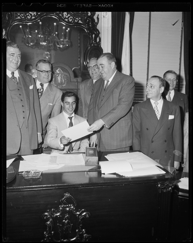 Tony DeSpirito receiving a document from Governor Paul Dever as group ...