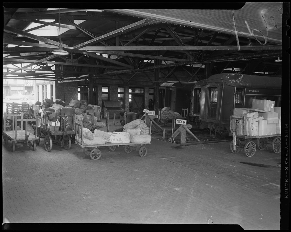 US Mail carts at train track depot - Digital Commonwealth