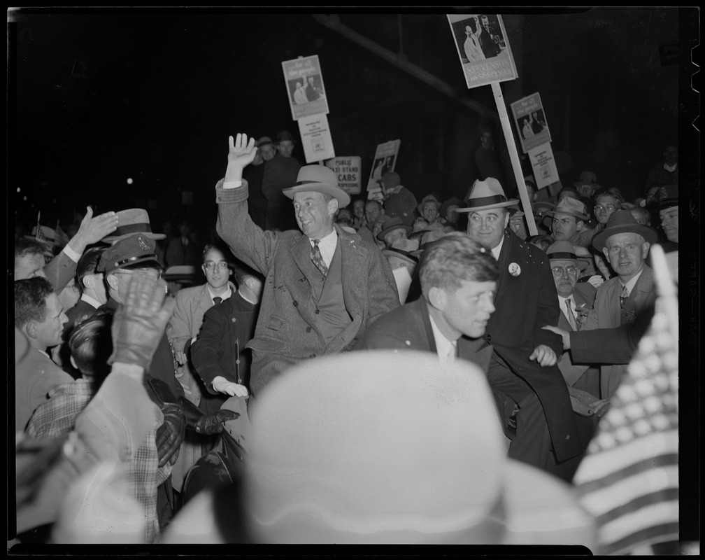 Adlai Stevenson waving to crowd from car with Paul Dever and John F ...