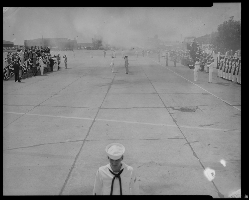 Groups of uniformed people standing at attention and saluting King ...