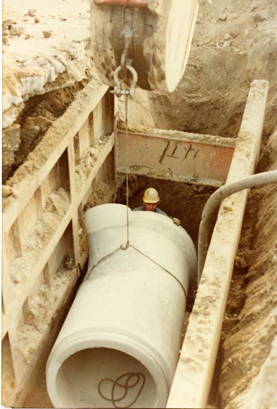 Construction worker laying pipe at 5 Cambridge Center - Digital ...