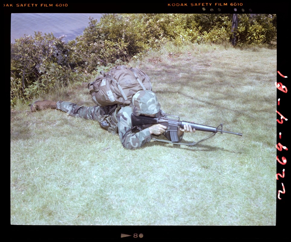 Combat arms div., prone position, woodland uniform, Kevlar helmet ...
