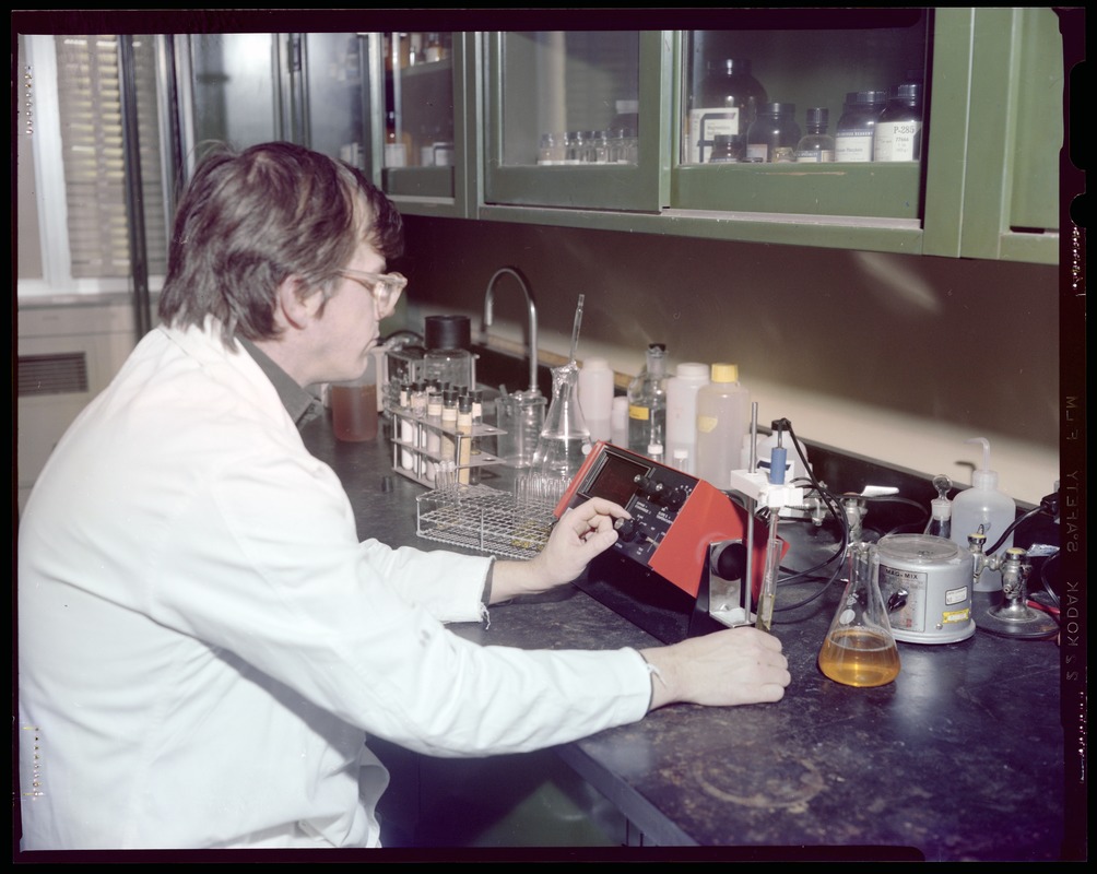 FSL, Dr. Sternberg in lab checking out test - Digital Commonwealth