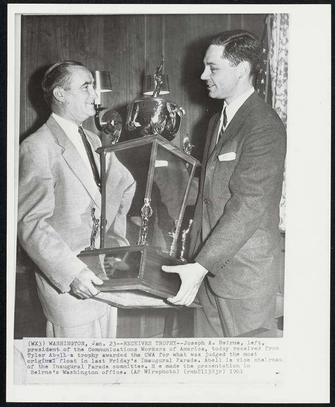 Receives Trophy--Joseph A. Beirne, left, president of the ...