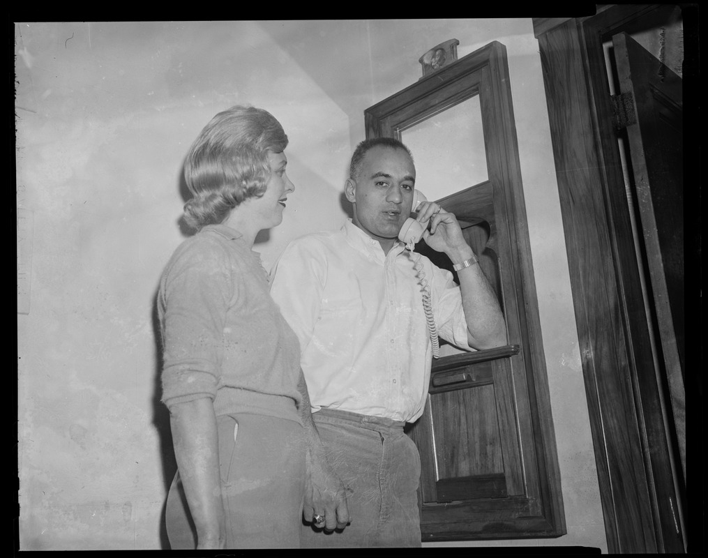 Lt. Governor-elect Francis Bellotti on phone with wife standing next to ...