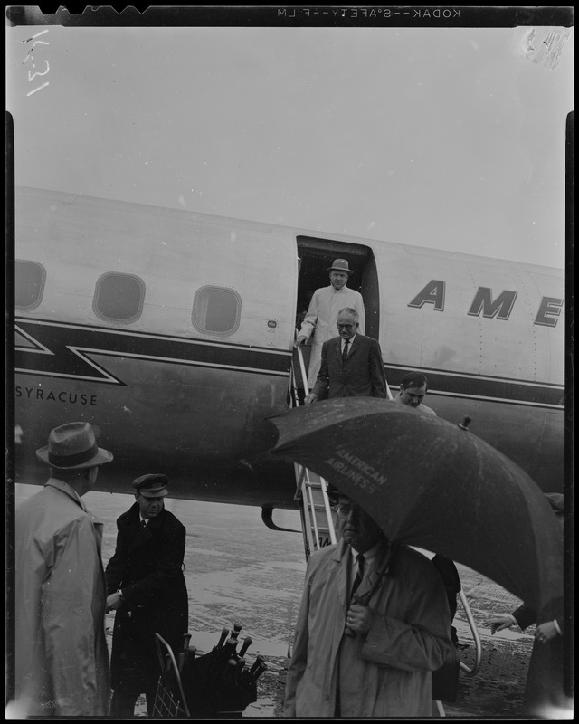 Sen. Barry Goldwater walking down stairs of American Airlines airplane ...