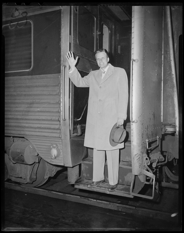 Billy Graham waving from stairs of train - Digital Commonwealth