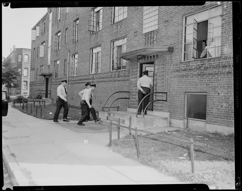 Police officers entering building - Digital Commonwealth