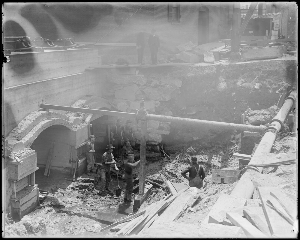 Head gate construction, showing part of head and beginning of arches ...