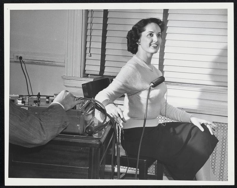 Florence Frances, of Park Drive. Demonstrating lie detector machine ...