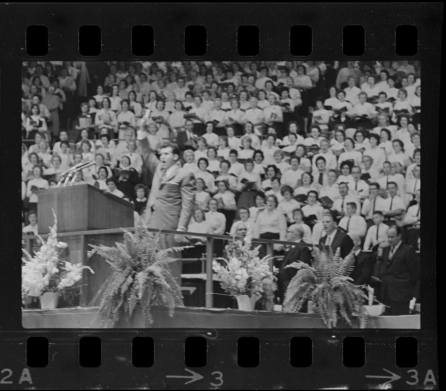 Speaker at Billy Graham crusade at Boston Garden, crowd in background ...